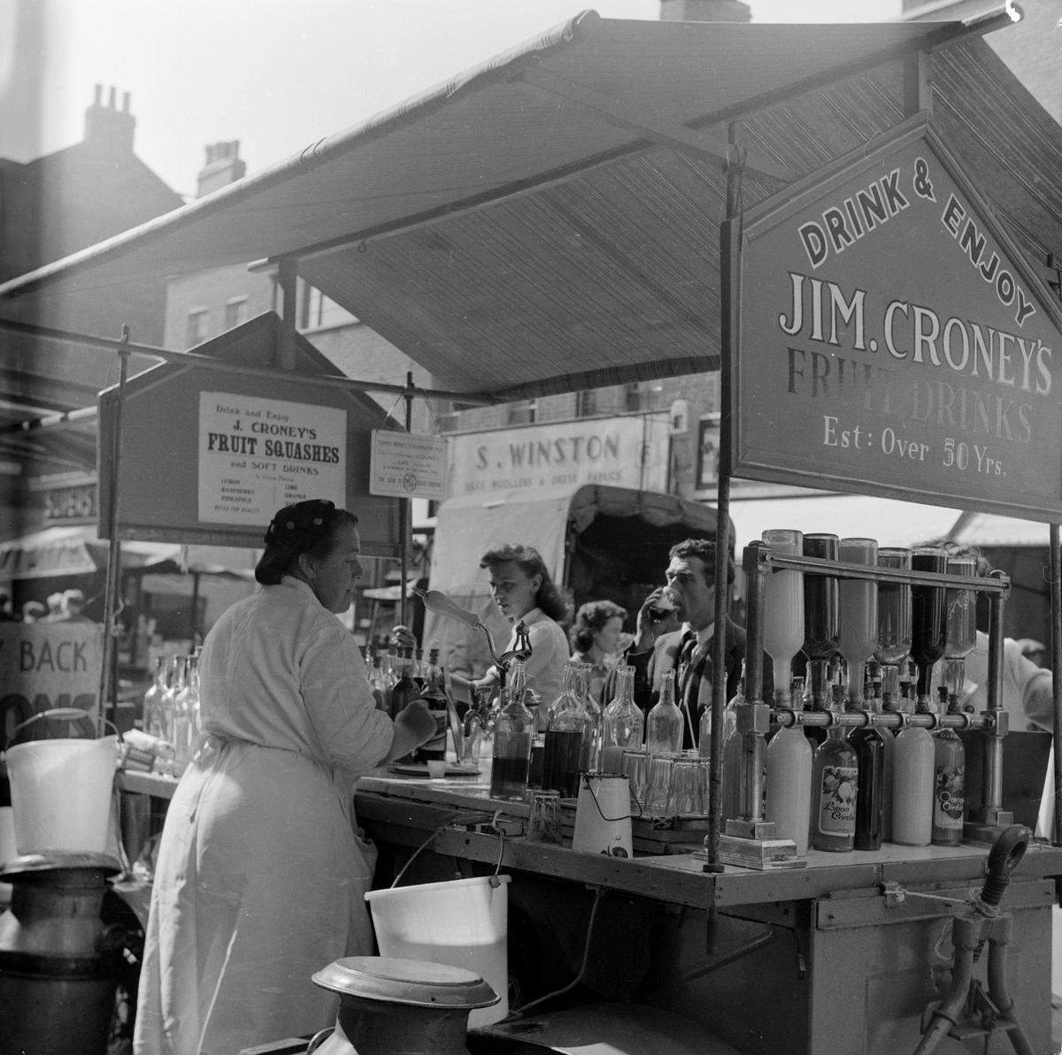 Jim Croney's Fruit and drink stall, Chapel Street Market | London Museum