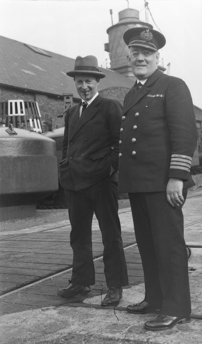 Port personalities: (LtoR) Commander Coleman and Mr A.C. Reynolds at ...